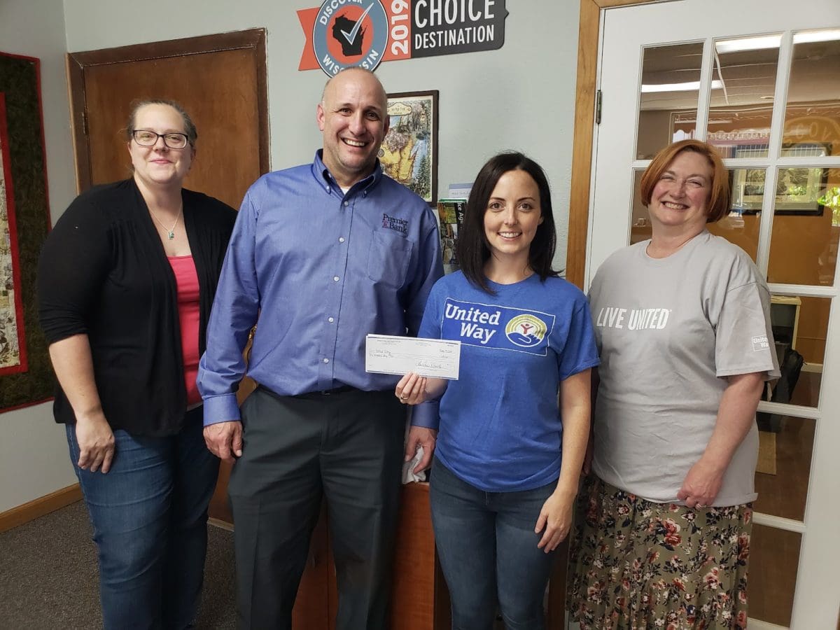 Representatives from Downtown Whitewater Inc. and PremierBank presented ...